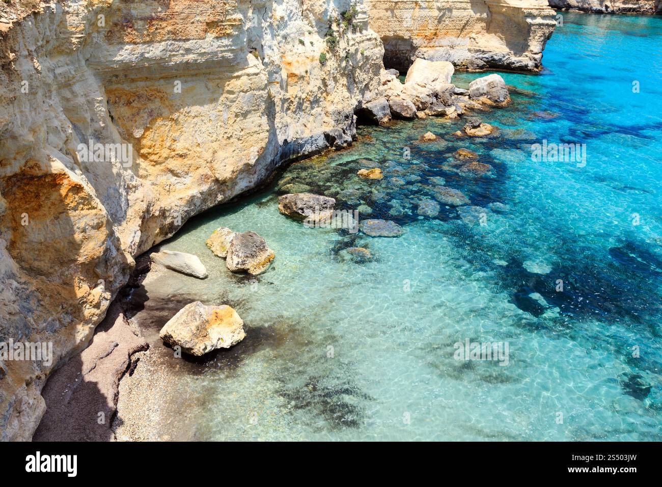 Picturesque seascape with cliffs, rocky arch and stacks (faraglioni ...