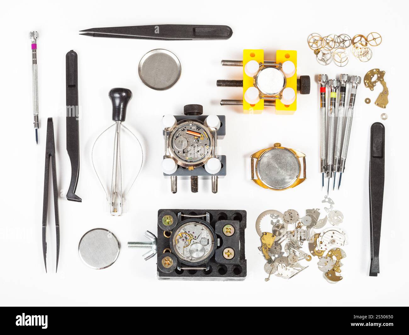 watchmaker workshop - top view of watch repairing tools on white ...