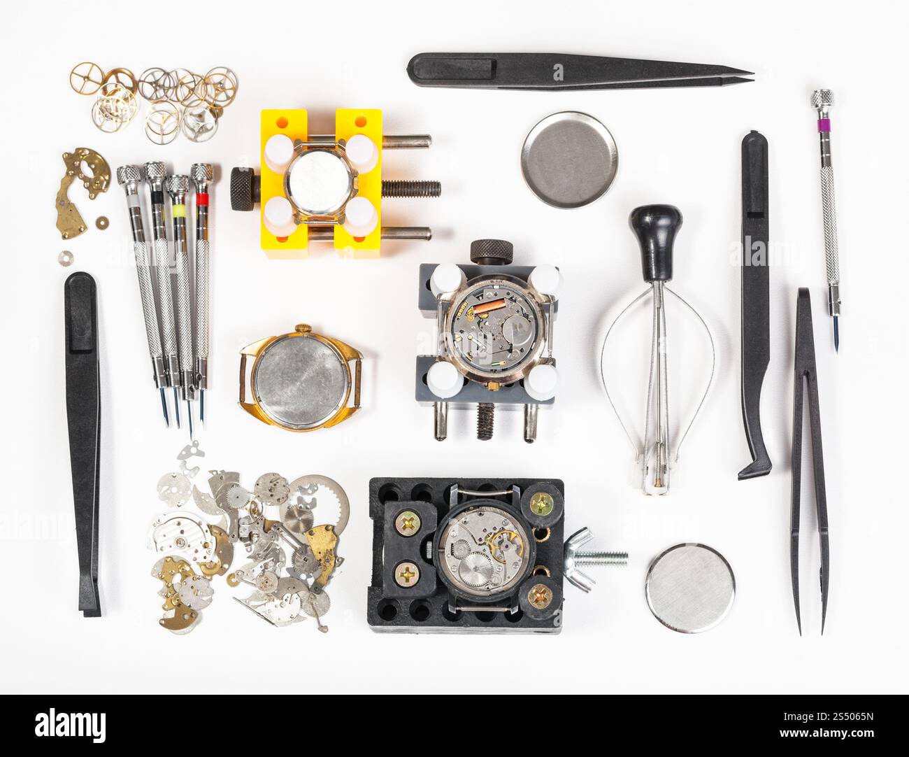 watchmaker workshop - above view of watch repairing tools on white ...