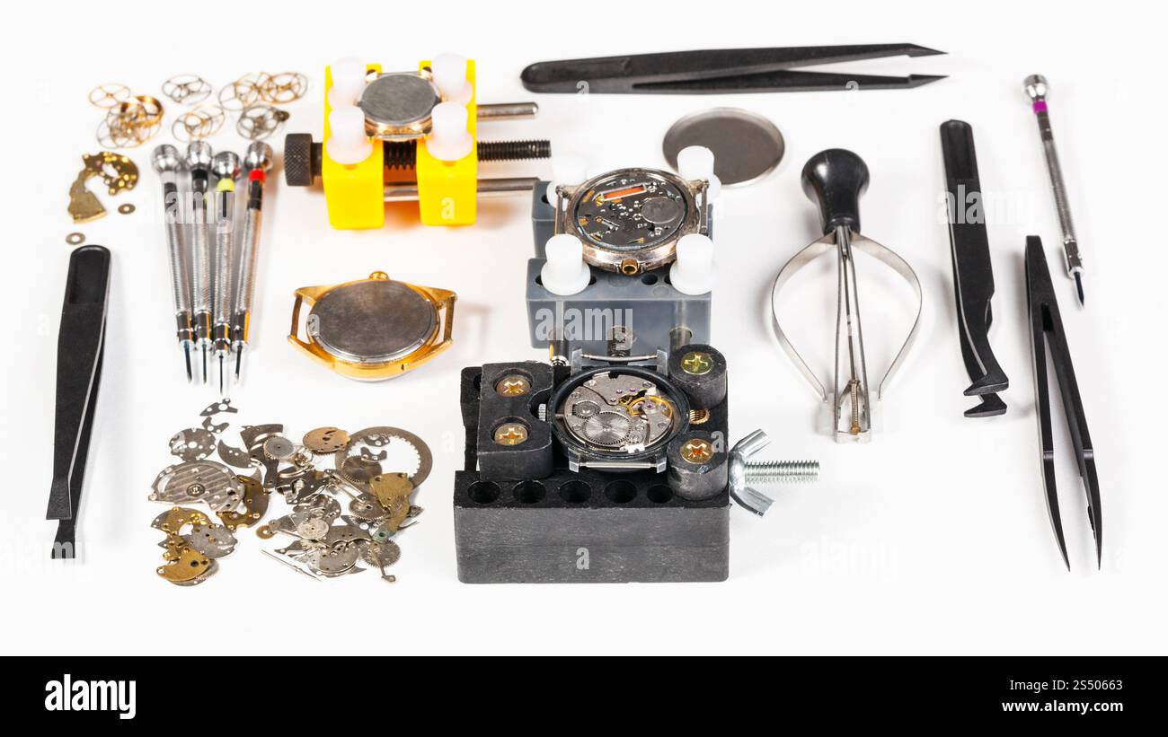 watchmaker workshop - top view of watch repairing tools on white ...