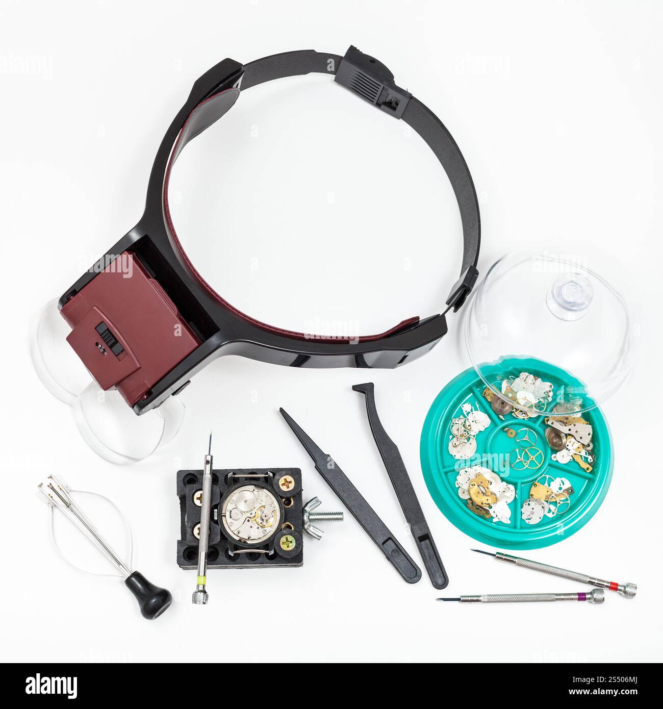 watchmaker workshop - top view of set of tools with head-mounted ...