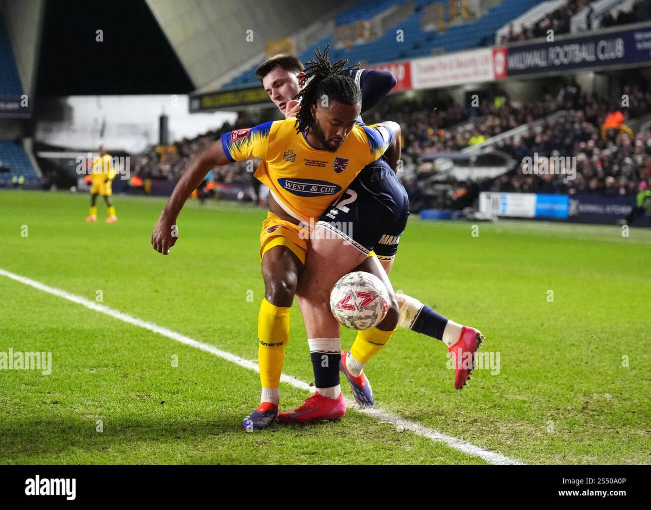 Dagenham and Redbridge's Trent Rendall and Millwall's Adam Mayor (right ...