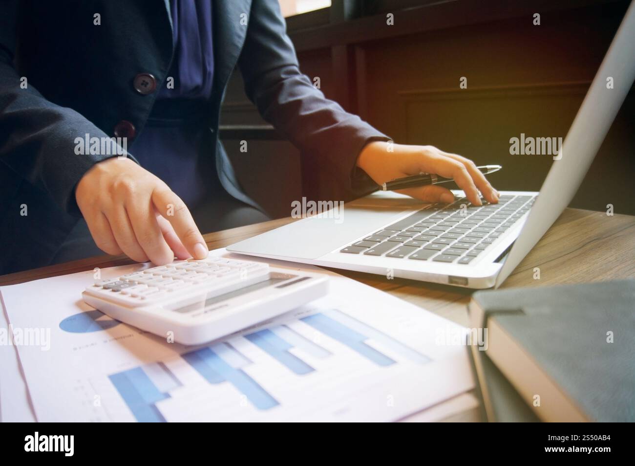 Business accounting women work with calculator and Laptop. Financial ...