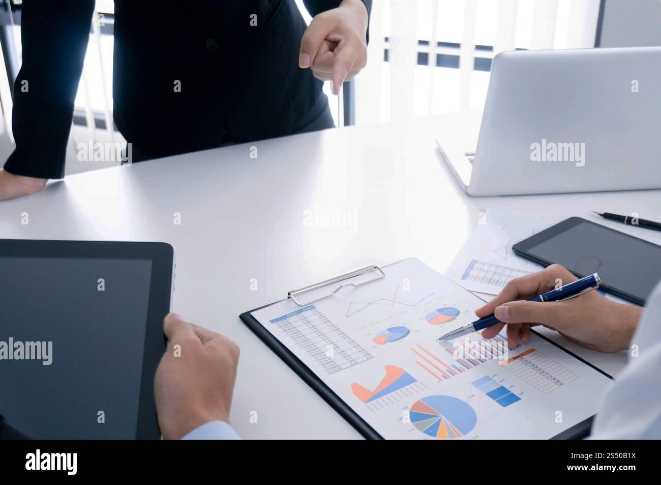 Business people making presentation with his colleagues and business ...