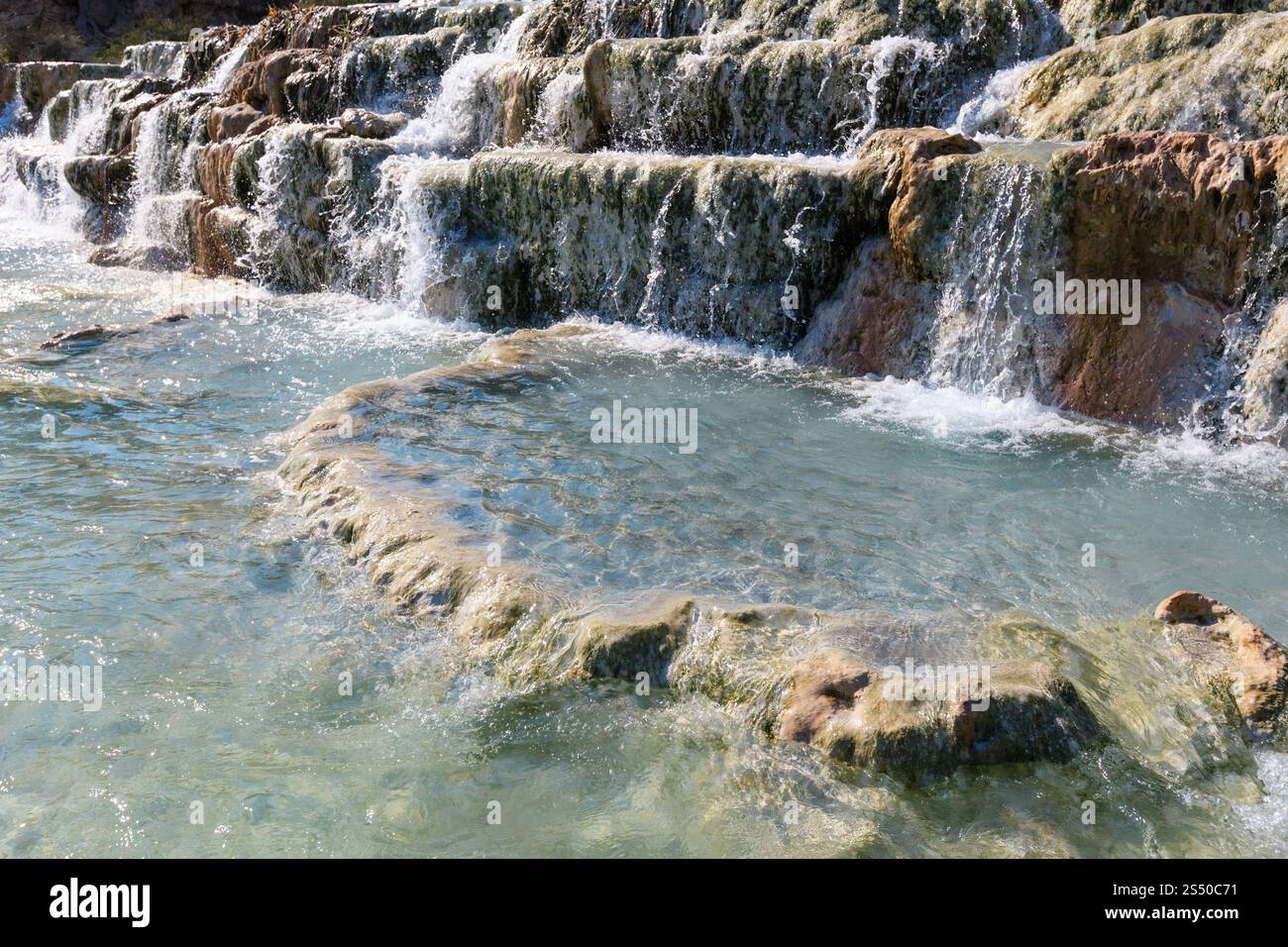 Natural spa with waterfalls and hot springs at Saturnia thermal baths ...