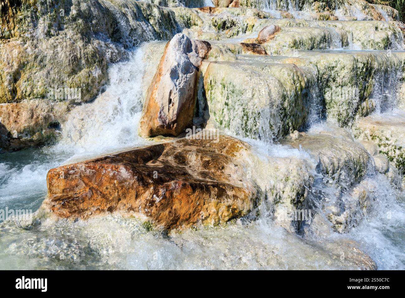 Natural spa with waterfalls and hot springs at Saturnia thermal baths ...