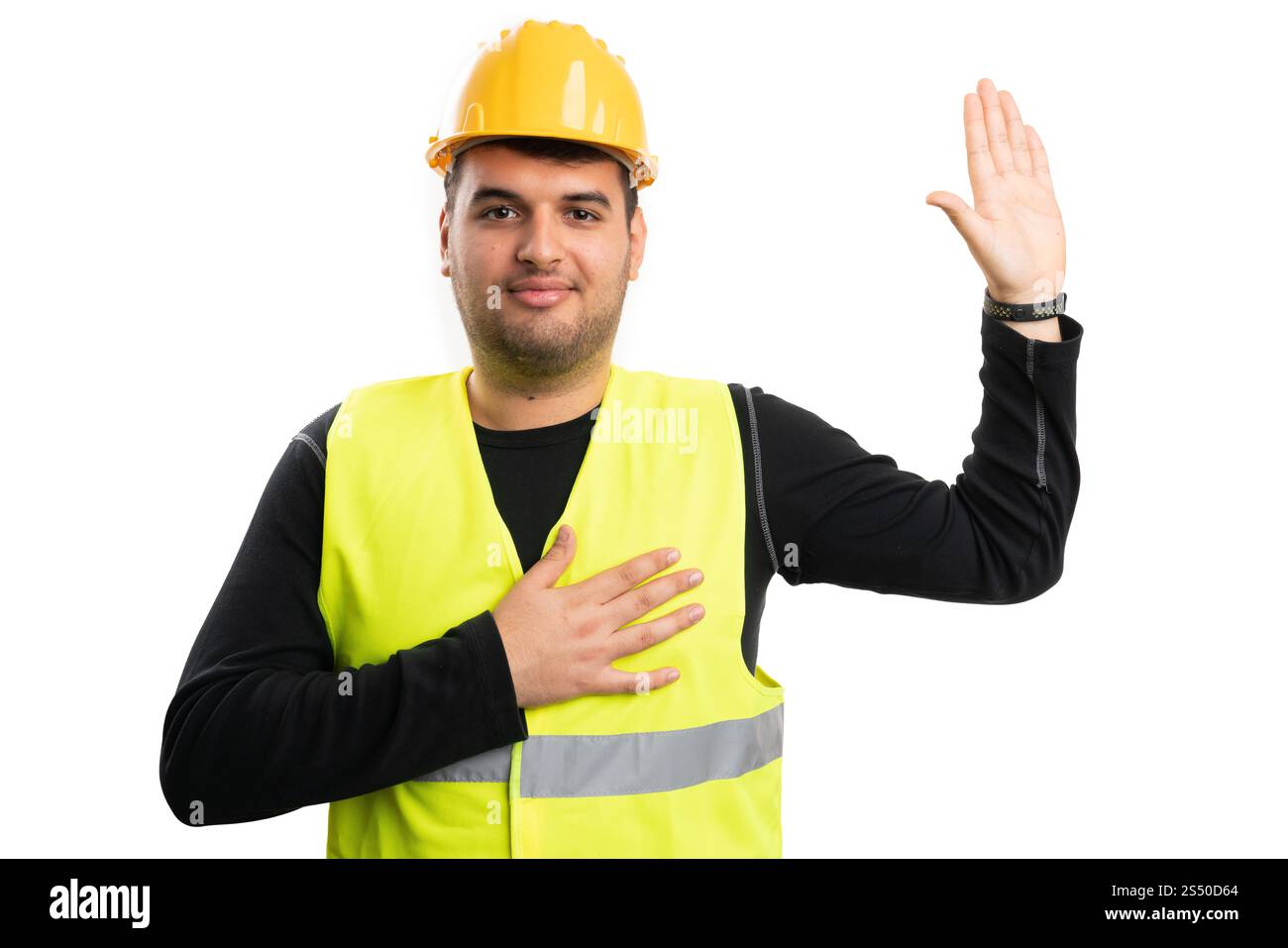 Serious adult constructor man wearing work vest and yellow hardhat ...
