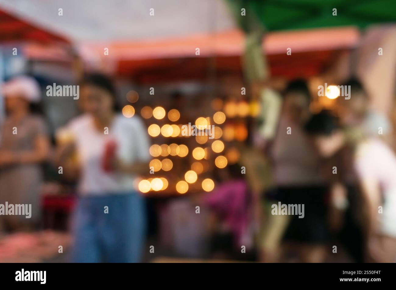 Blurred background of people shopping at night market festival for ...