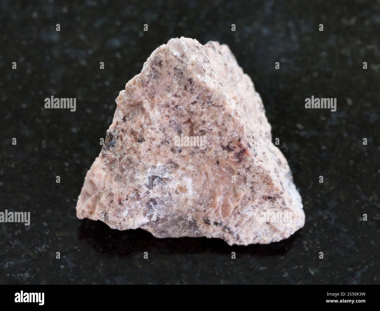 macro shooting of natural mineral rock specimen - rough Granite stone ...