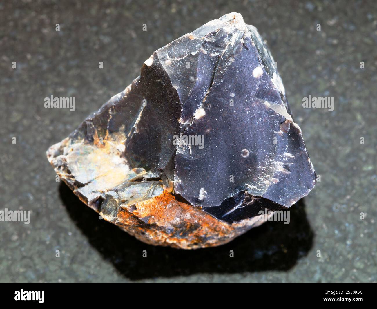 macro shooting of natural mineral rock specimen - rough black Flint ...