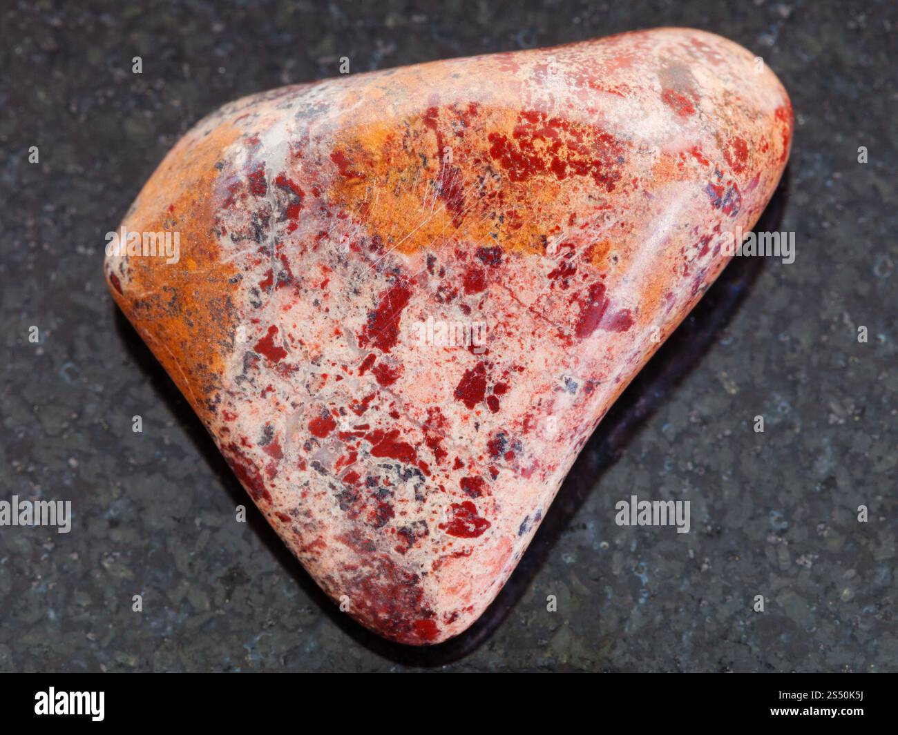 macro shooting of natural mineral rock specimen - tumbled Brecciated ...