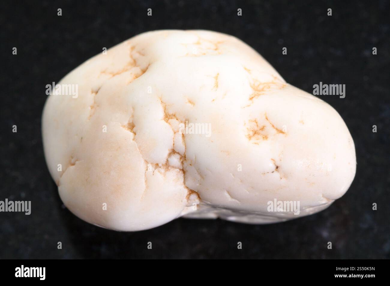 macro shooting of natural mineral rock specimen - pebble of magnesite ...