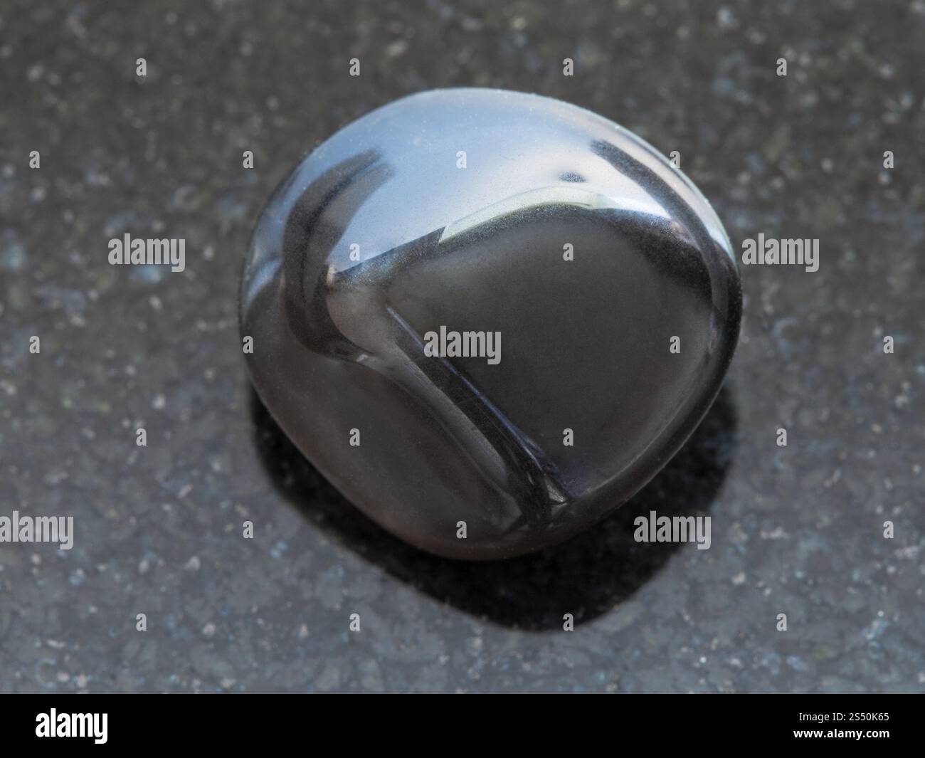 macro shooting of natural mineral rock specimen - polished obsidian ...