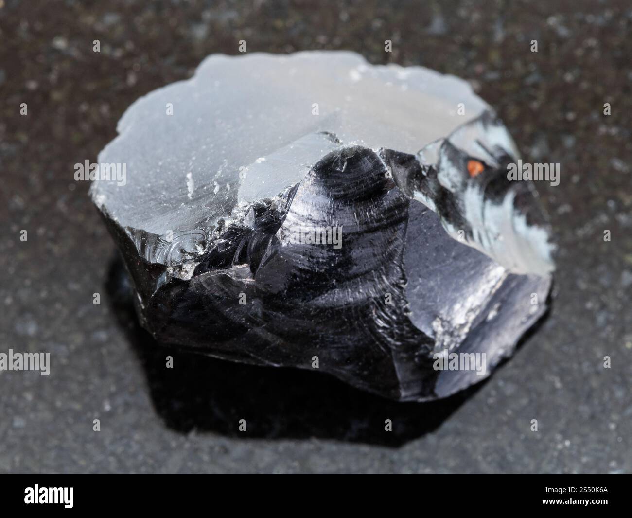 macro shooting of natural mineral rock specimen - rough obsidian ...
