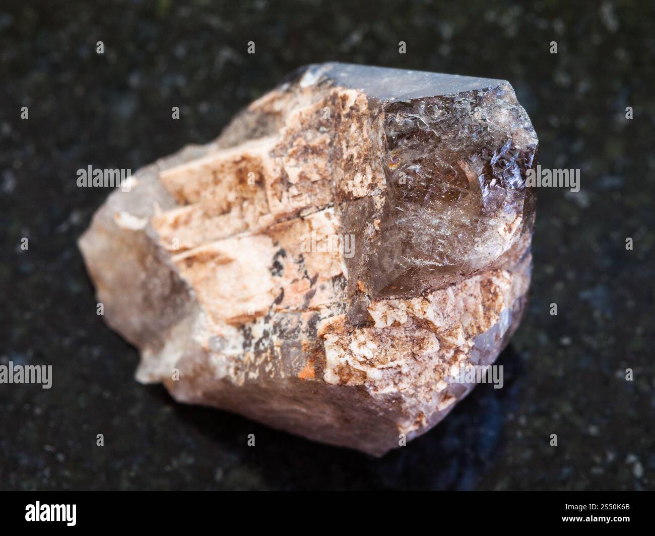 macro shooting of natural mineral rock specimen - raw crystal of smoky ...