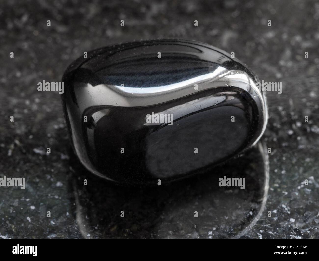 macro shooting of natural mineral rock specimen - polished black Onyx ...