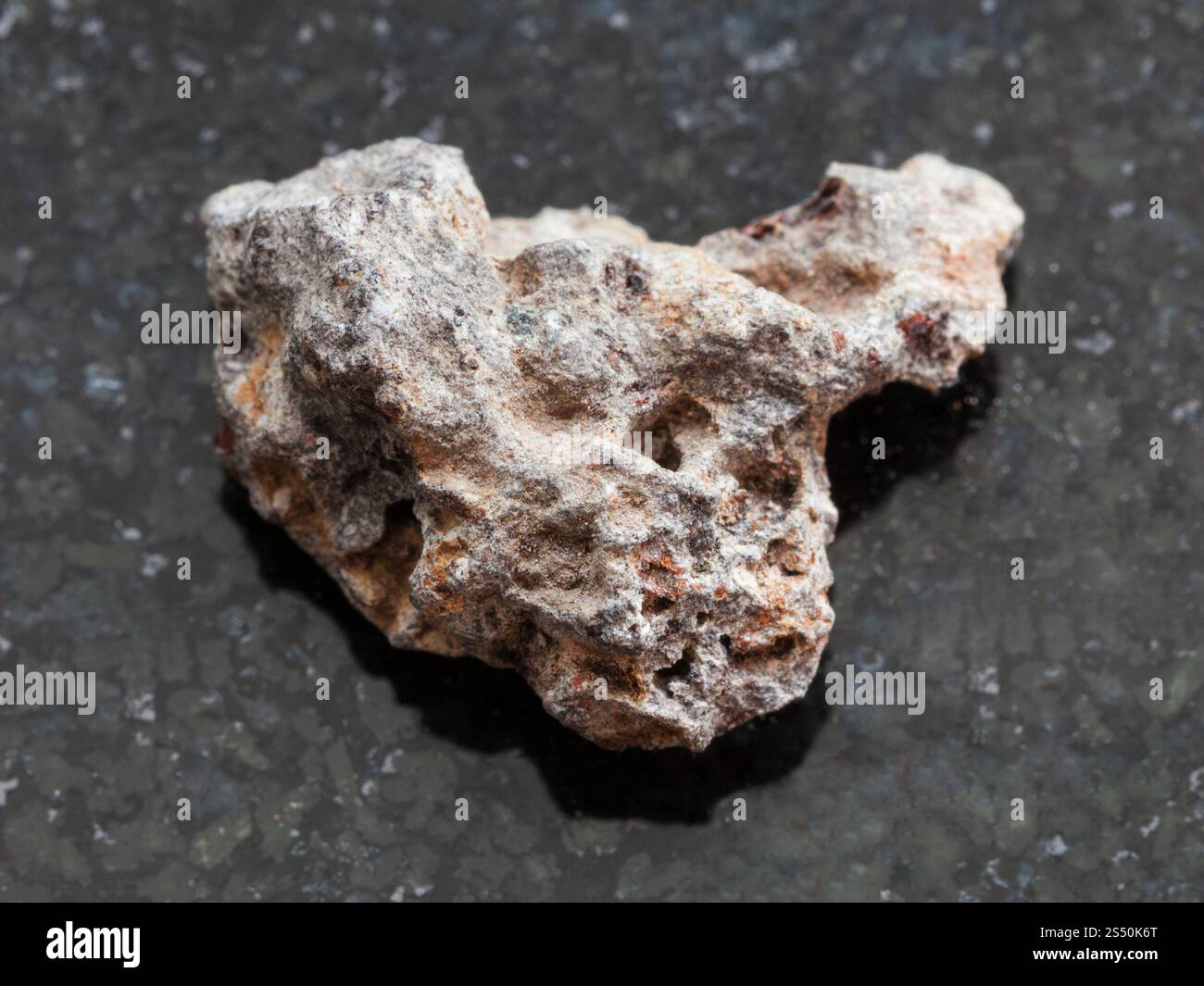 macro shooting of natural mineral rock specimen - raw Basalt stone on ...