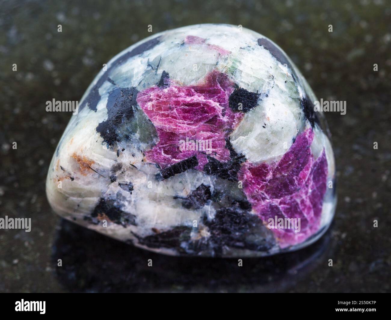 macro shooting of natural mineral stone specimen - tumbled pink ...