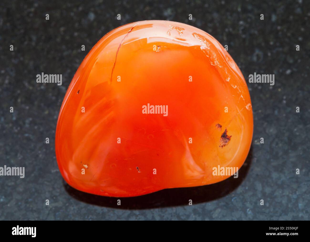 macro shooting of natural mineral rock specimen - tumbled carnelian gem ...