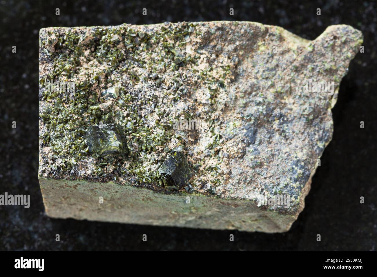 macro shooting of natural mineral stone specimen - rough green crystals ...