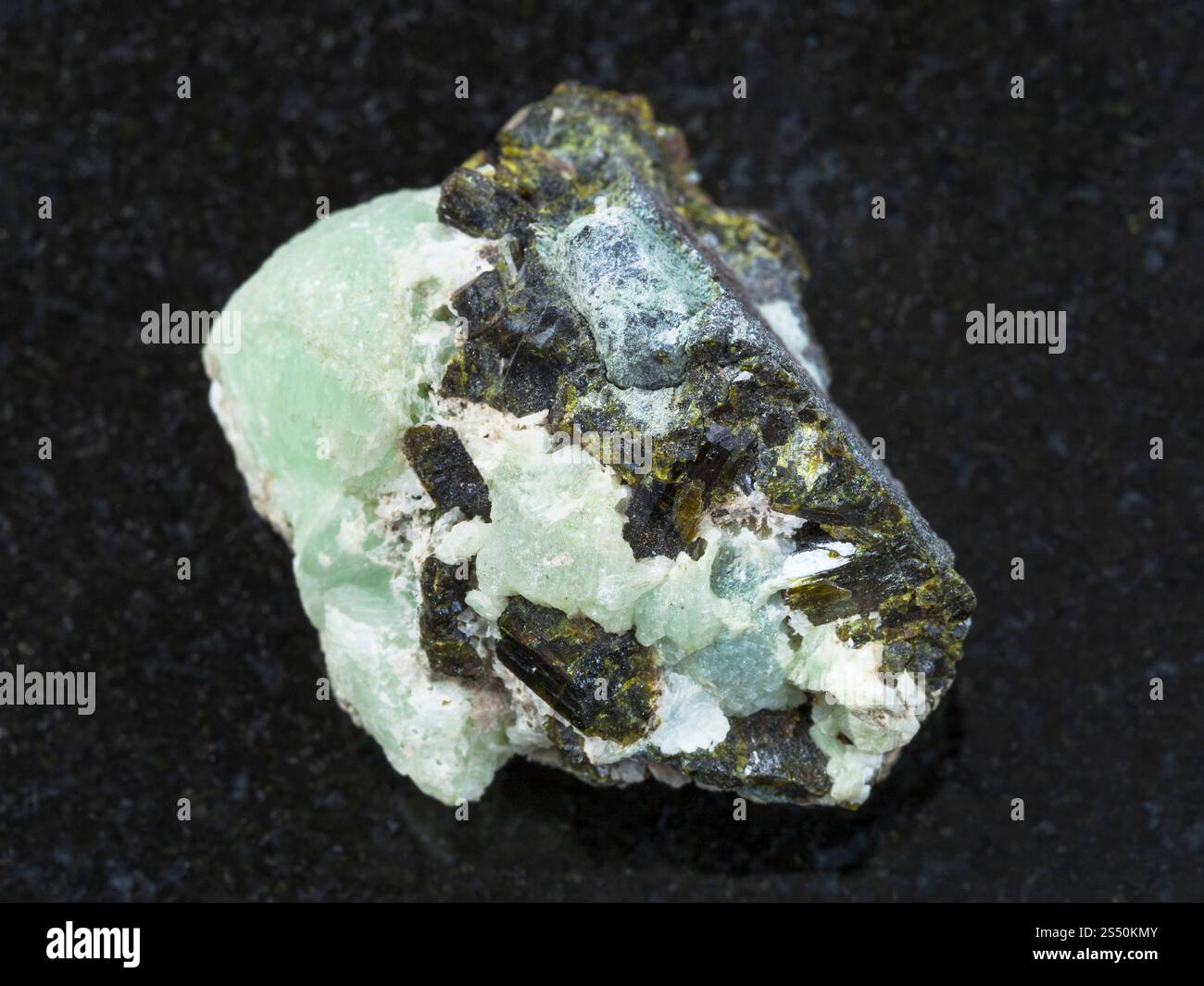 macro shooting of natural mineral stone specimen - Epidote crystals on ...