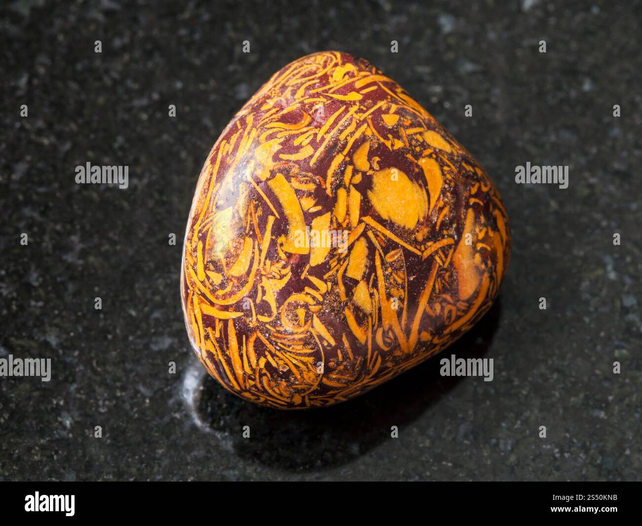 macro shooting of natural mineral rock specimen - tumbled Mariam Stone ...