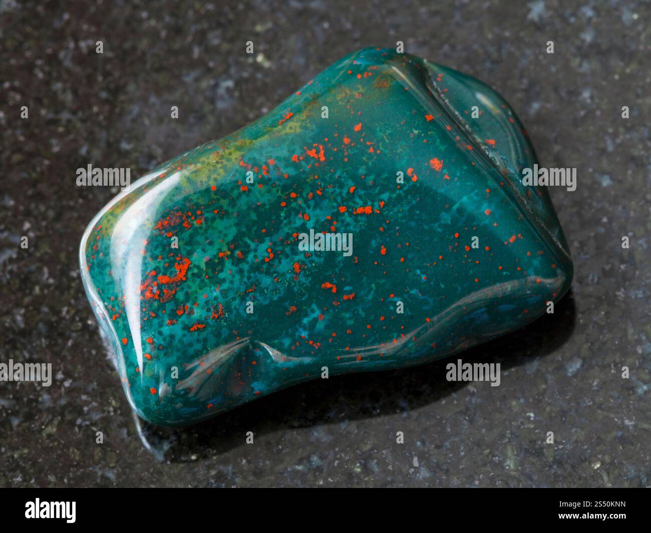macro shooting of natural mineral rock specimen - tumbled green ...