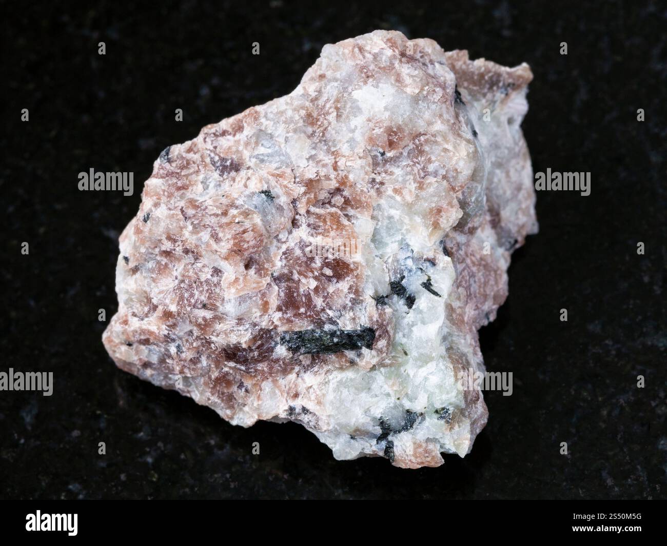 macro shooting of natural mineral rock specimen - raw Miserite stone on ...