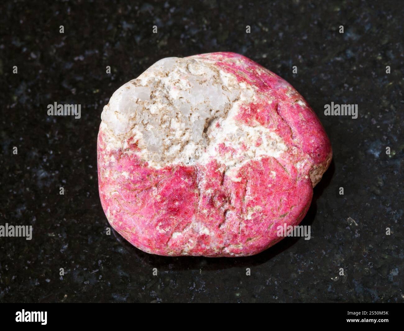 macro shooting of natural mineral rock specimen - tumbled Thulite ...