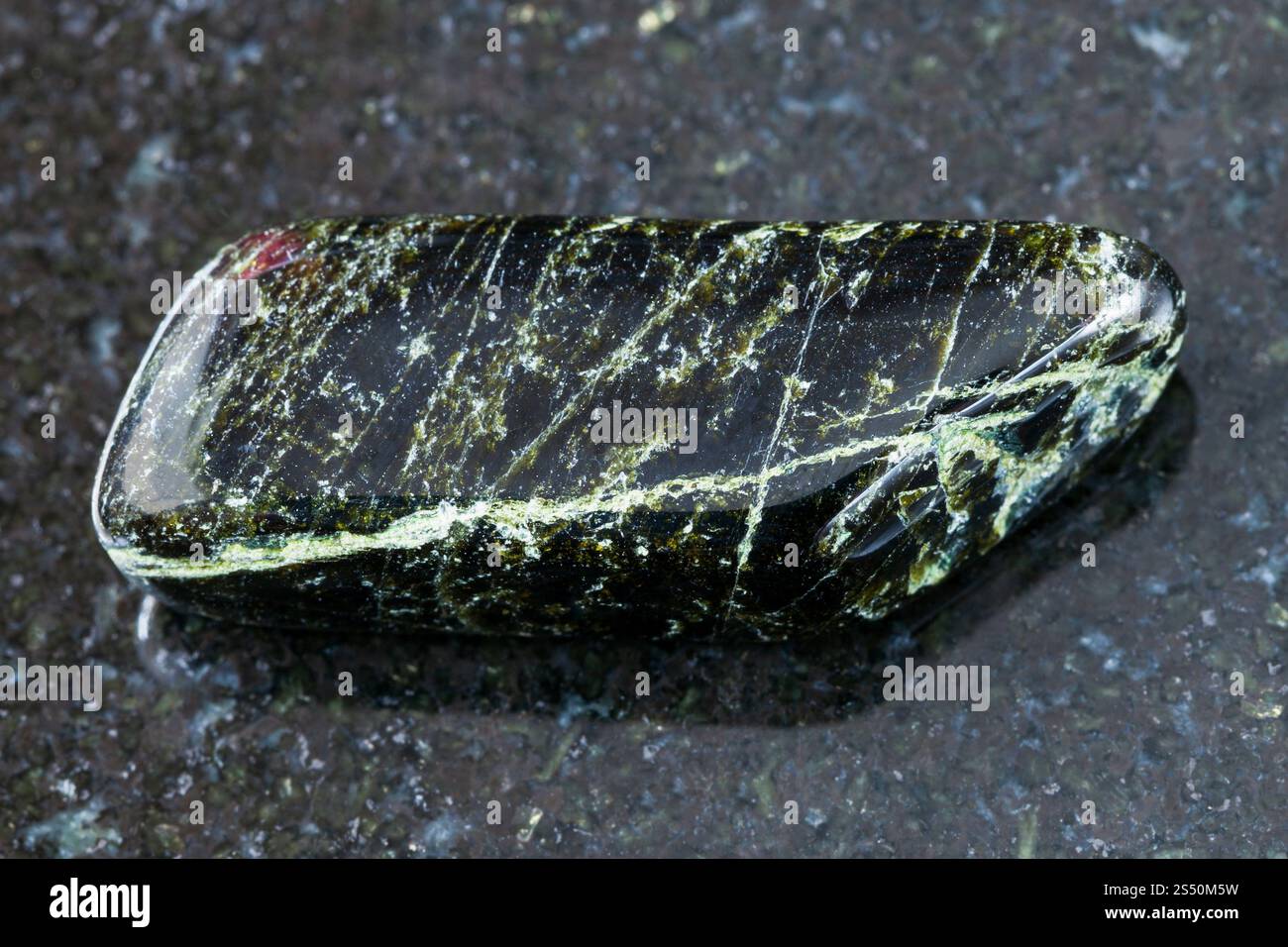 macro shooting of natural mineral rock specimen - polished Diopside ...