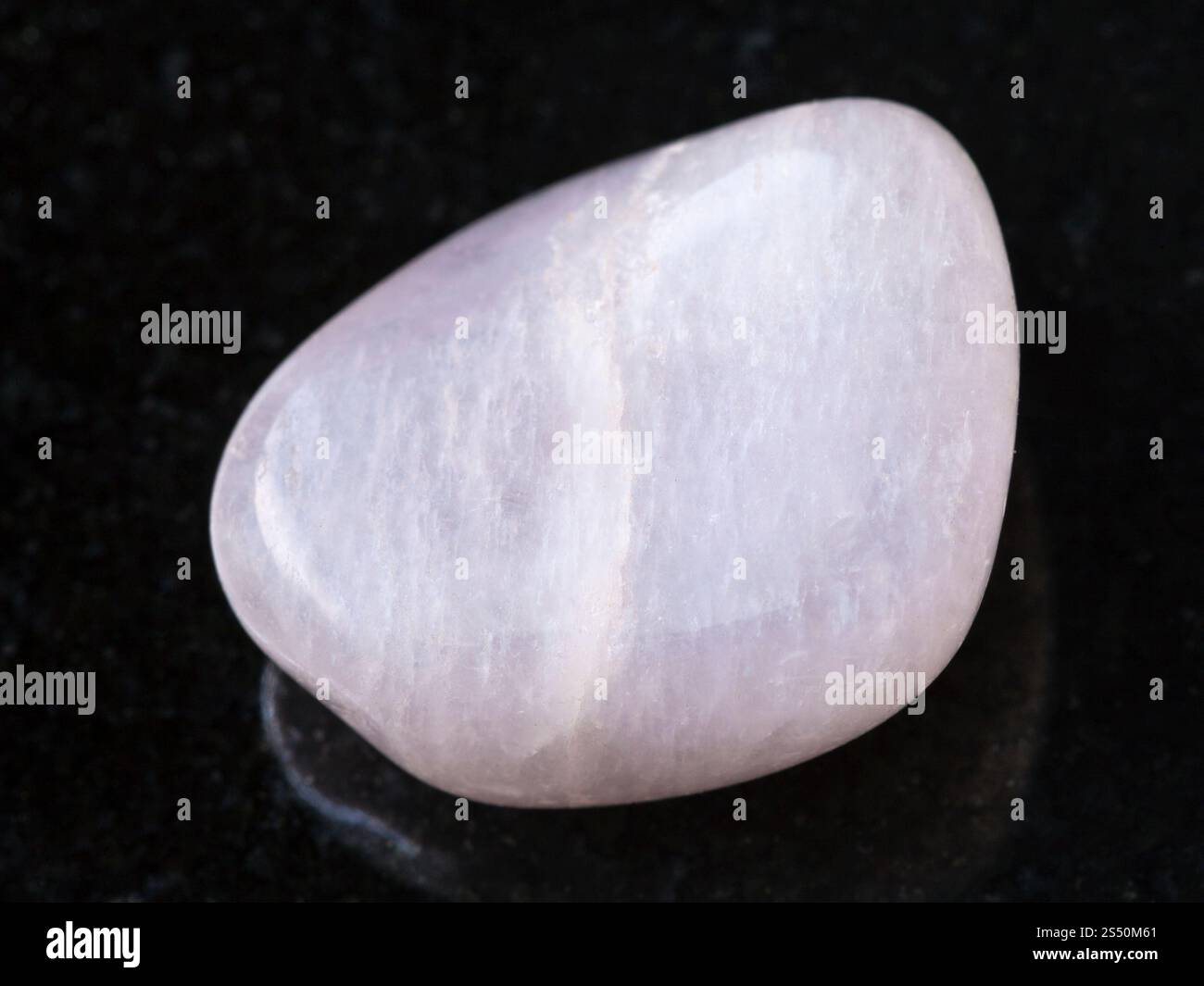 macro shooting of natural mineral rock specimen - tumbled pink petalite ...