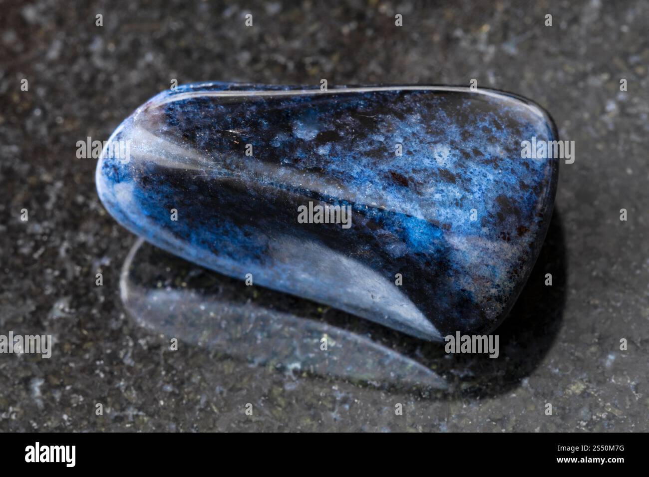macro shooting of natural mineral rock specimen - tumbled dumortierite ...