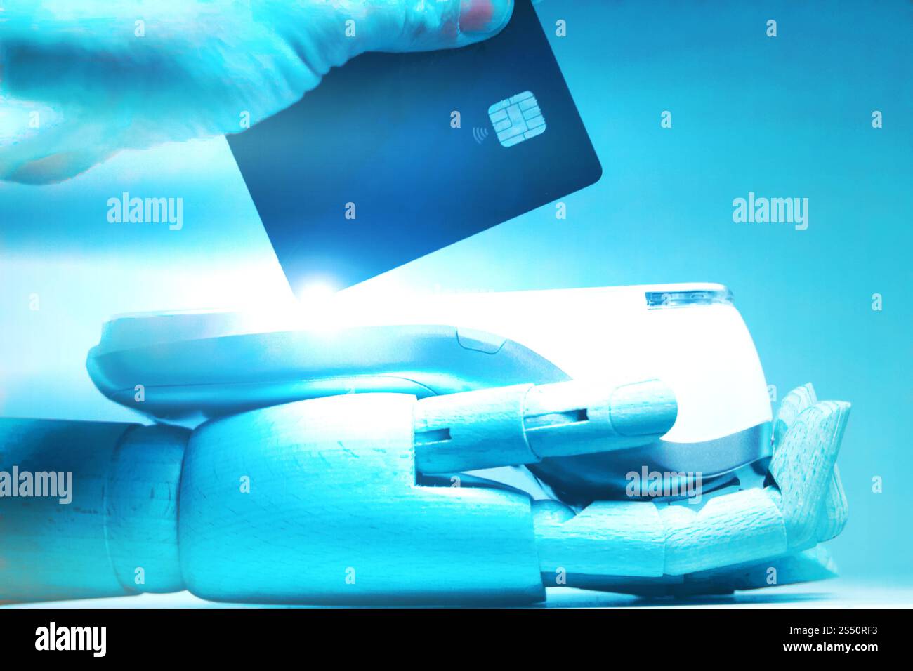 Credit card payment with Robot's hand holding credit card terminal ...