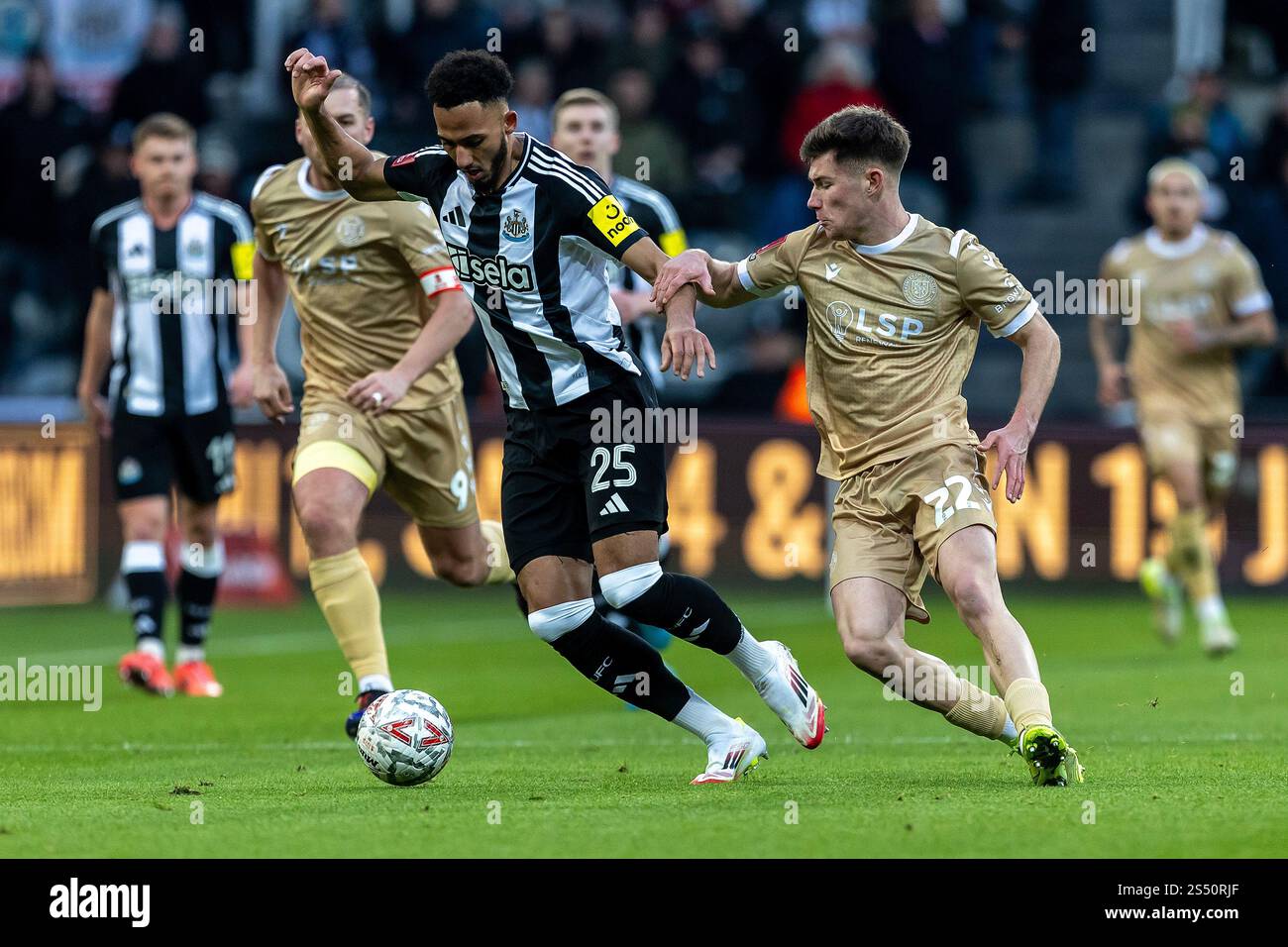 Newcastle United's Lloyd Kelly in action with Bromley's Cameron ...