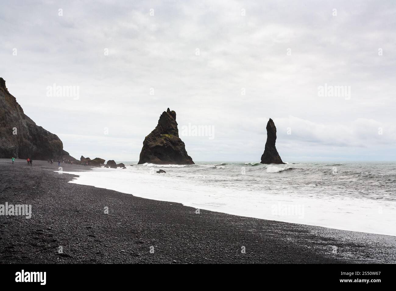 travel to Iceland - view of Reynisfjara Beach with Reynisdrangar basalt ...