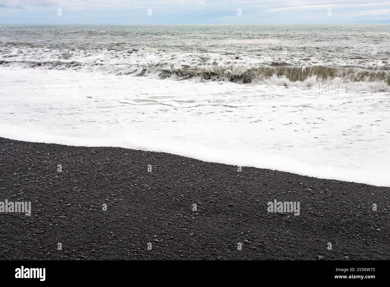travel to Iceland - ocean waves on Reynisfjara Beach in Iceland, near ...