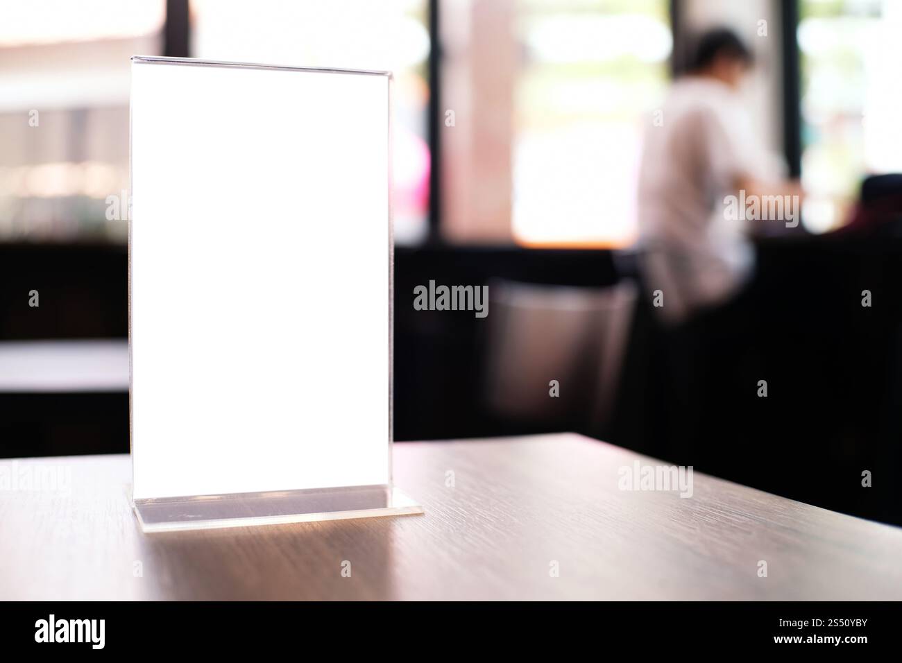 Mock up Menu frame standing on wood table in Bar restaurant cafe. space ...