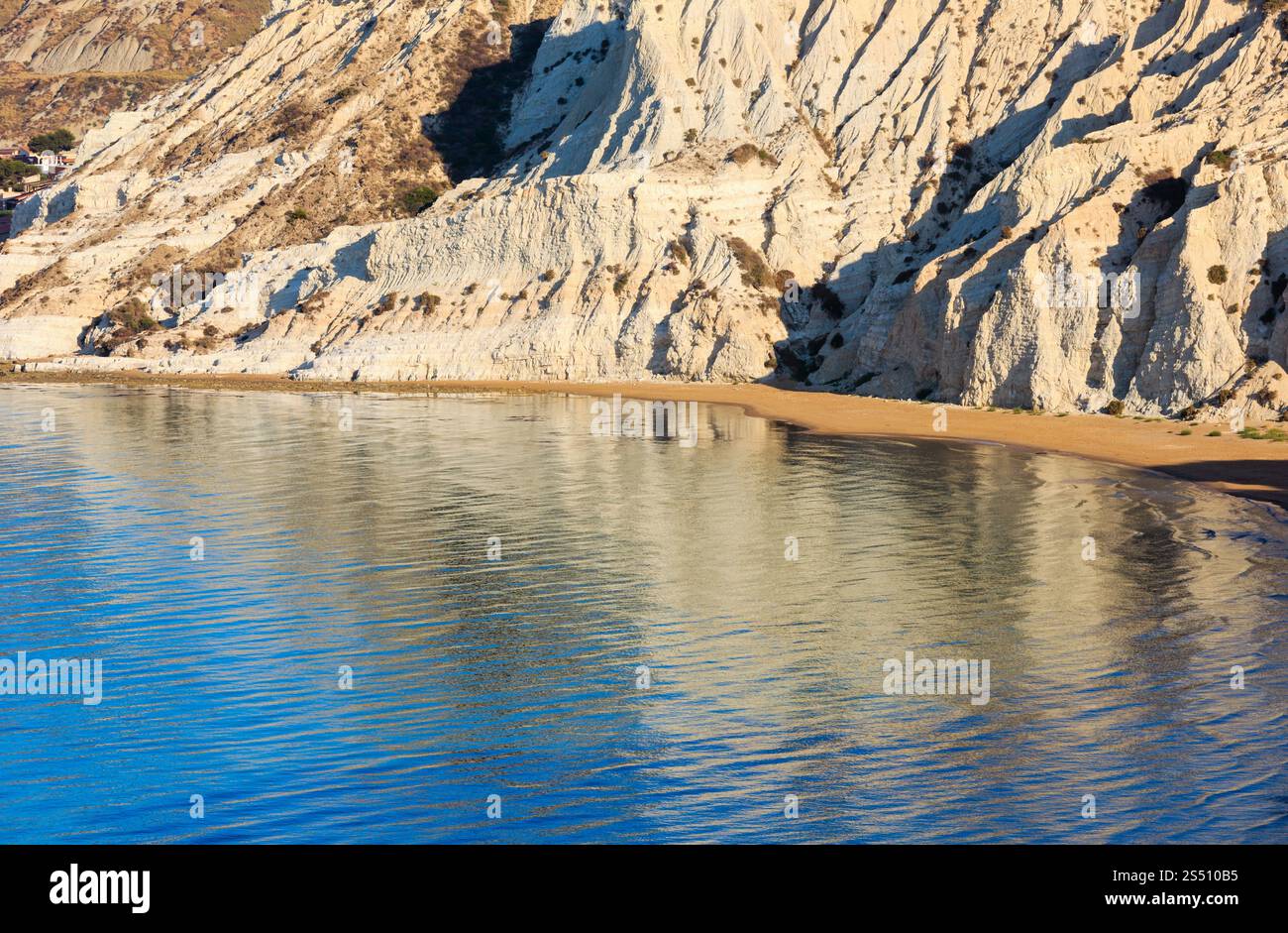Sandy beach under famed white cliff, called Scala dei Turchi", in ...