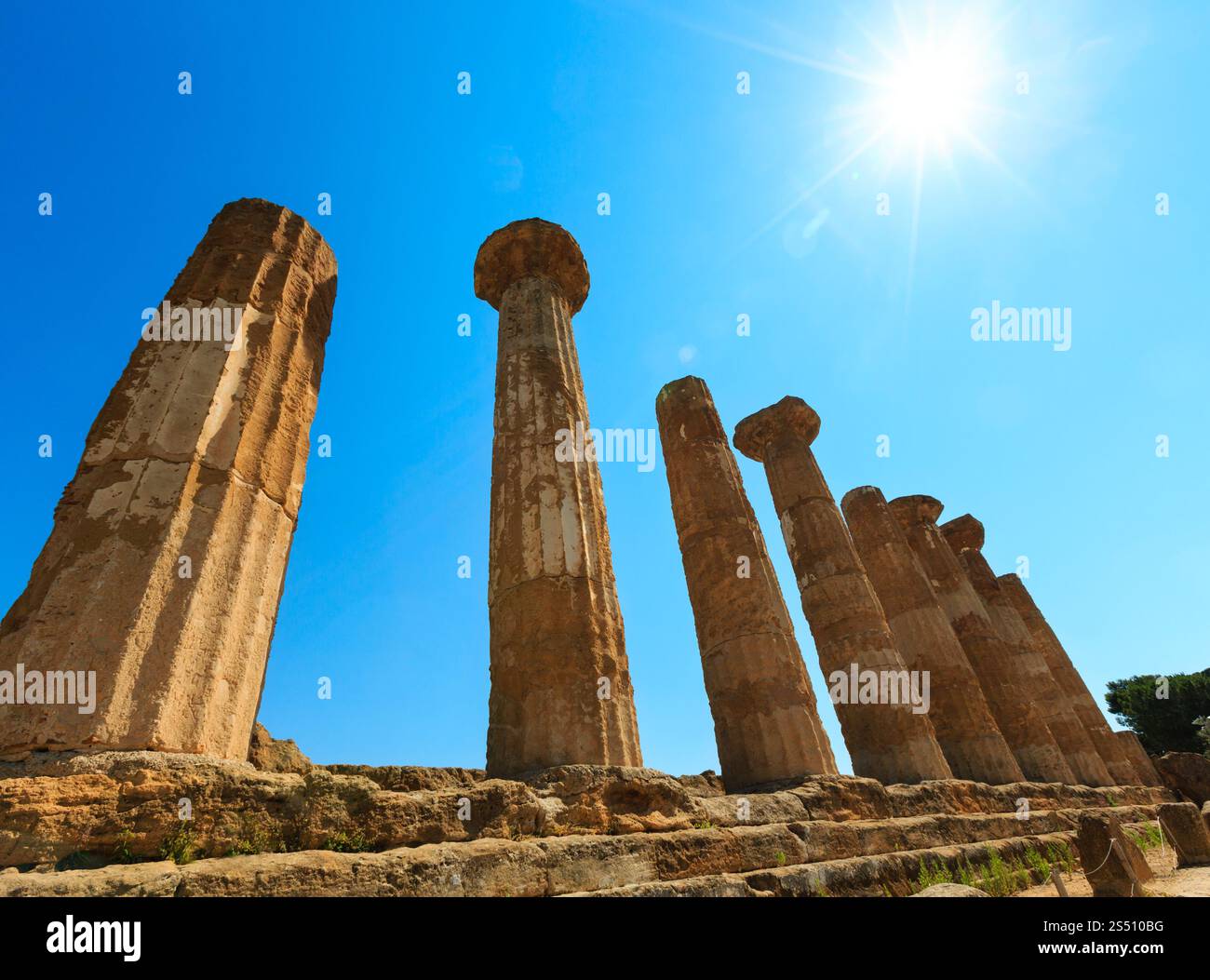 Sunshine above ruined Temple of Heracles columns in famous ancient ...