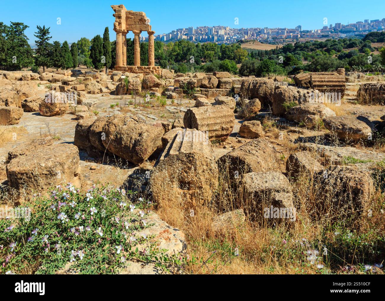 Temple of Dioscuri (Castor and Pollux) with Agrigento town in the ...
