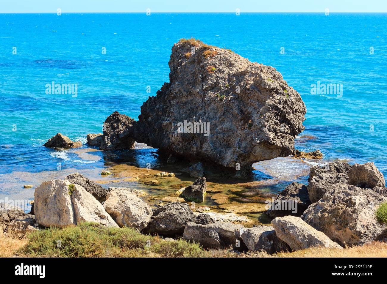 Rock in sea near beach Cala Paradiso near Rocca di San Nicola ...