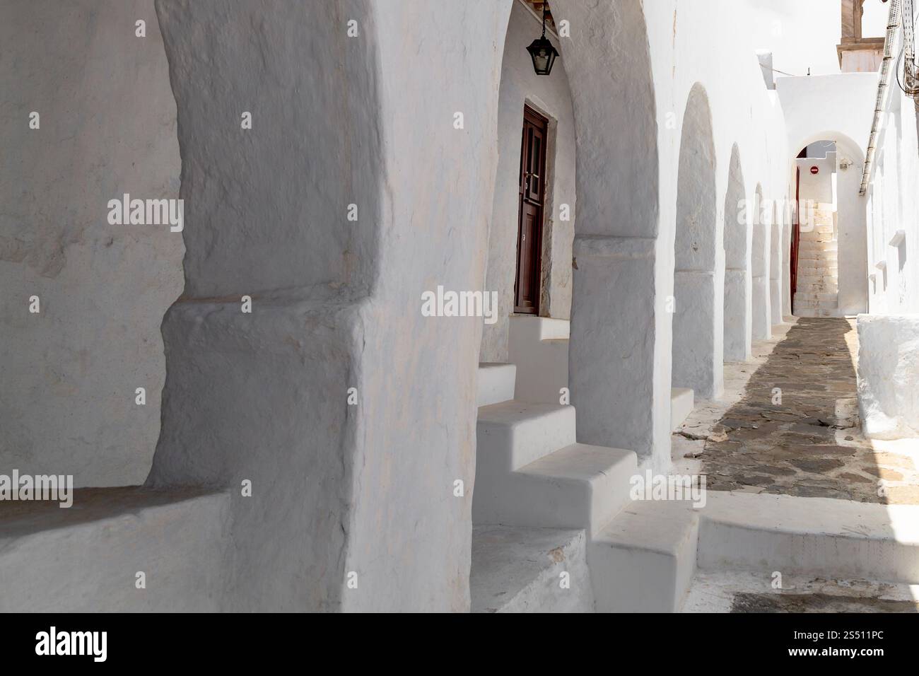 Traditional Whitewashed Alley With Stone Arches and Steps in ...