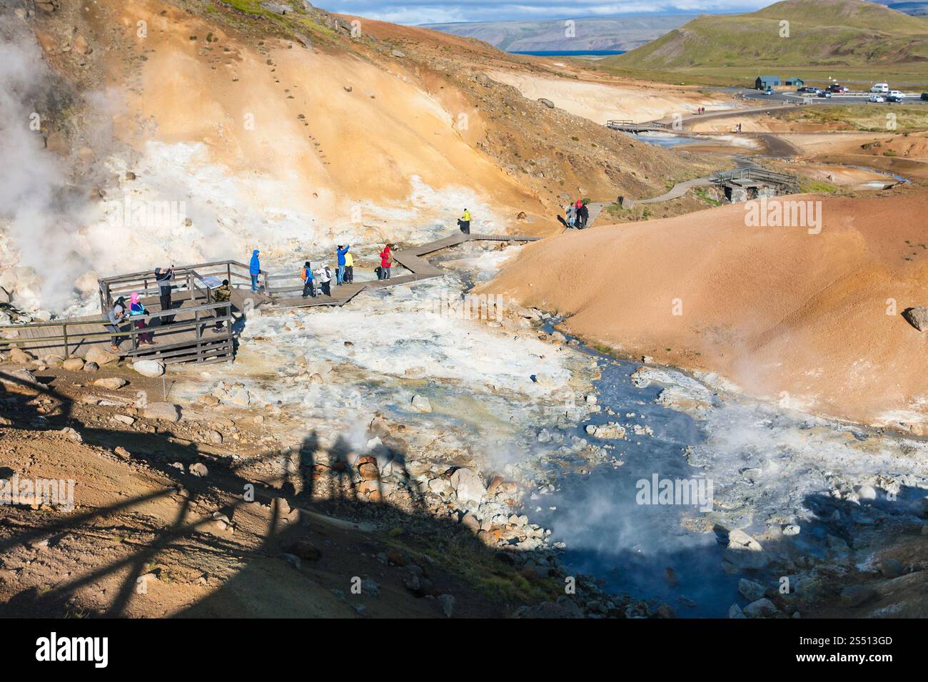 travel to Iceland - people at viewpoint in geothermal Krysuvik area on ...
