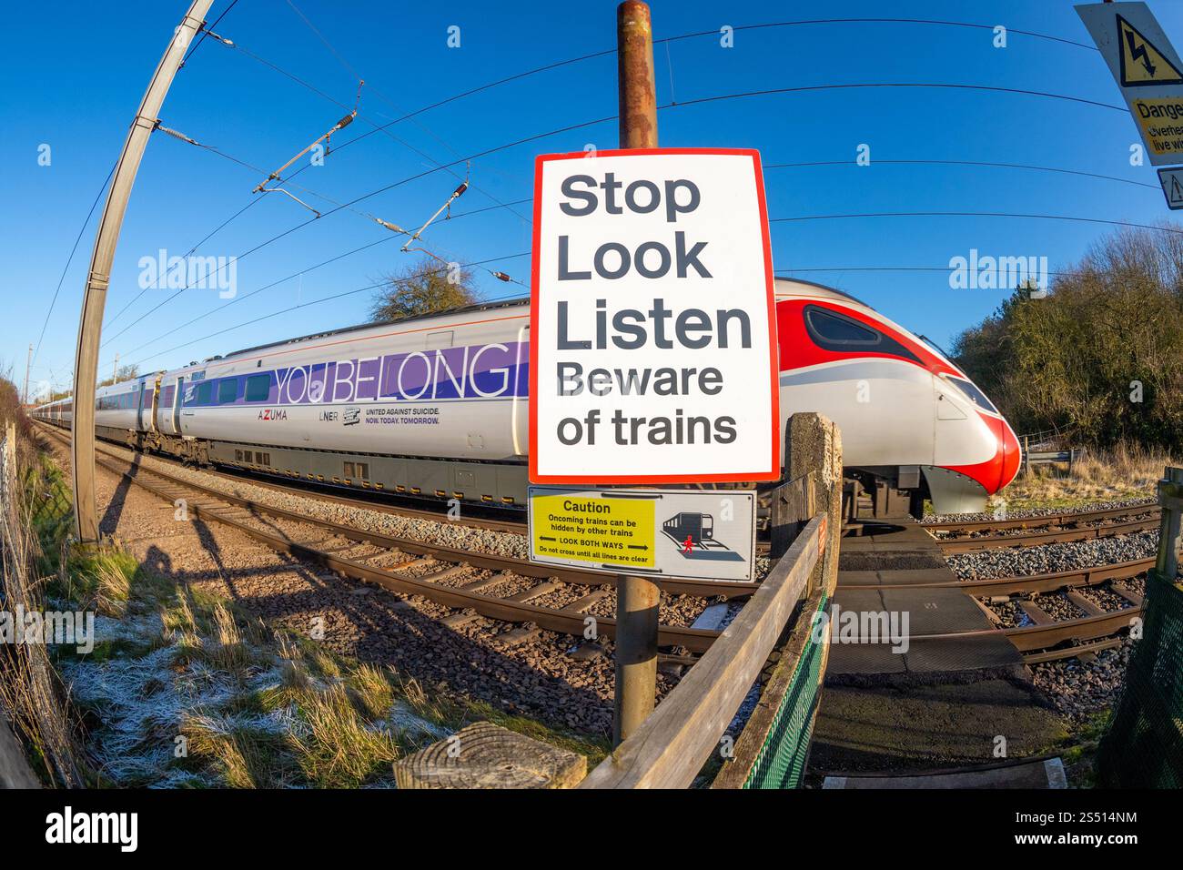 Caution, Look both ways and Stop Look Listern warning signs at level ...