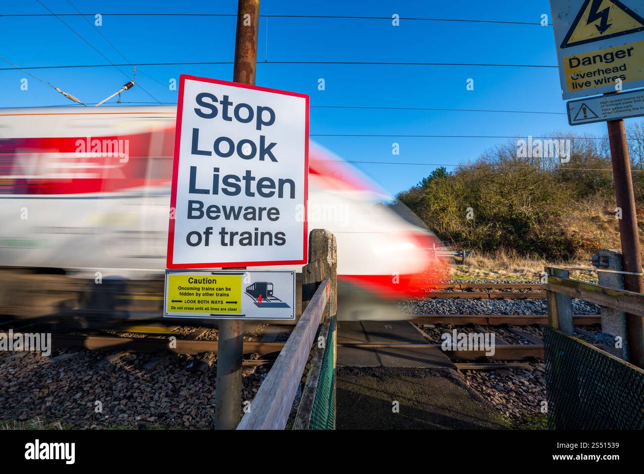 Caution, Look both ways and Stop Look Listern warning signs at level ...
