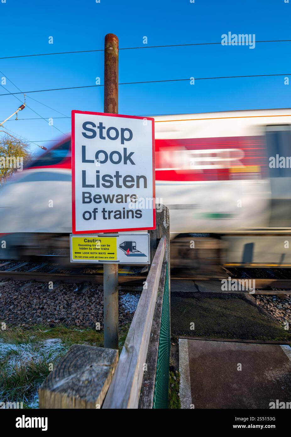 Caution, Look both ways and Stop Look Listern warning signs at level ...