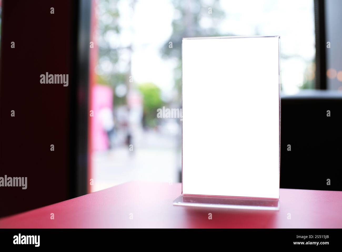 Mock up Menu frame standing on wood table in Bar restaurant cafe. space ...