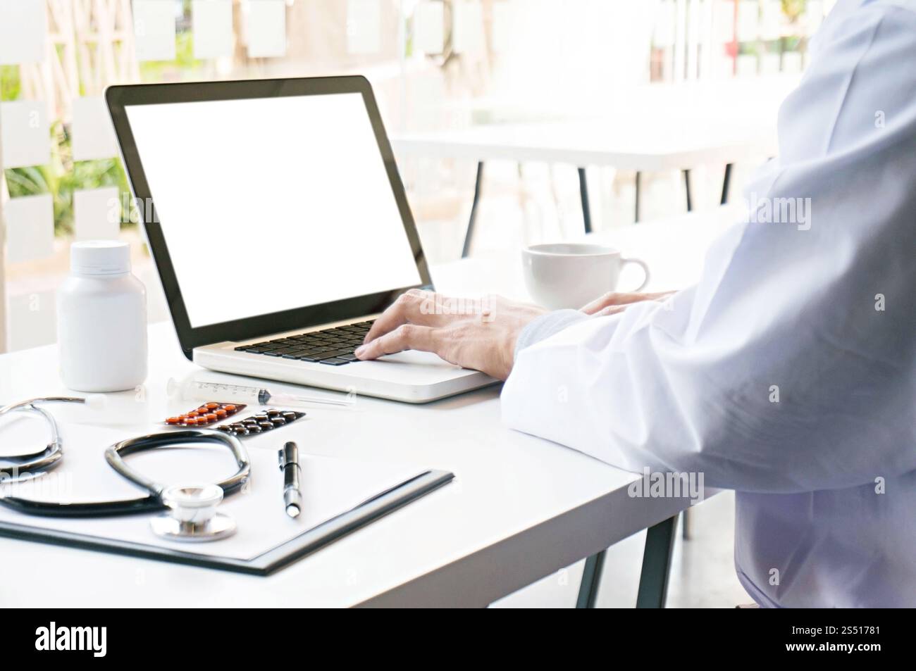 View of Details of doctor hands typing on keyboard with blank screen ...