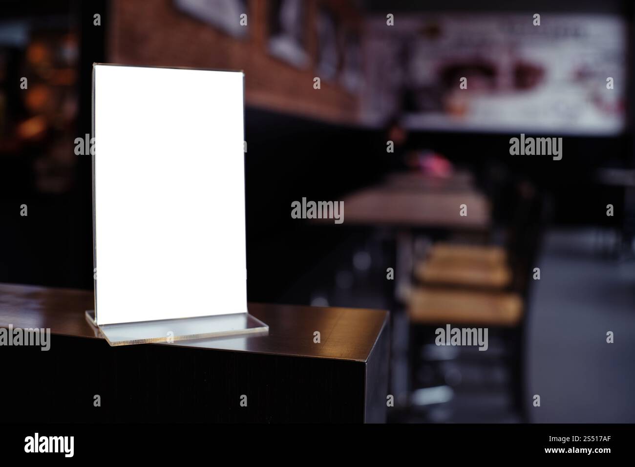 Mock up Menu frame standing on wood table in Bar restaurant cafe. space ...