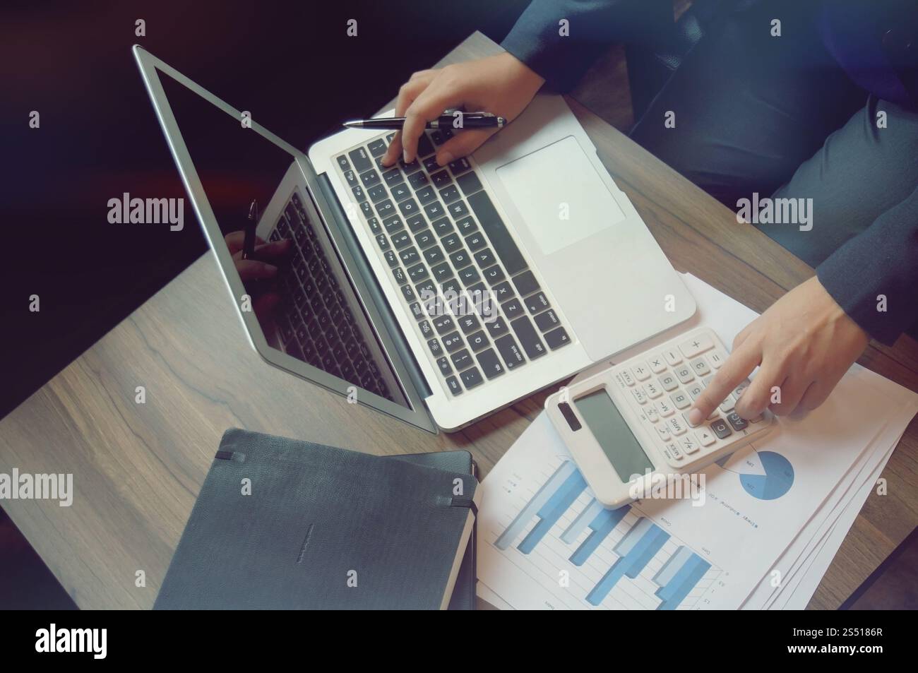 Business accounting women work with calculator and Laptop. Financial ...